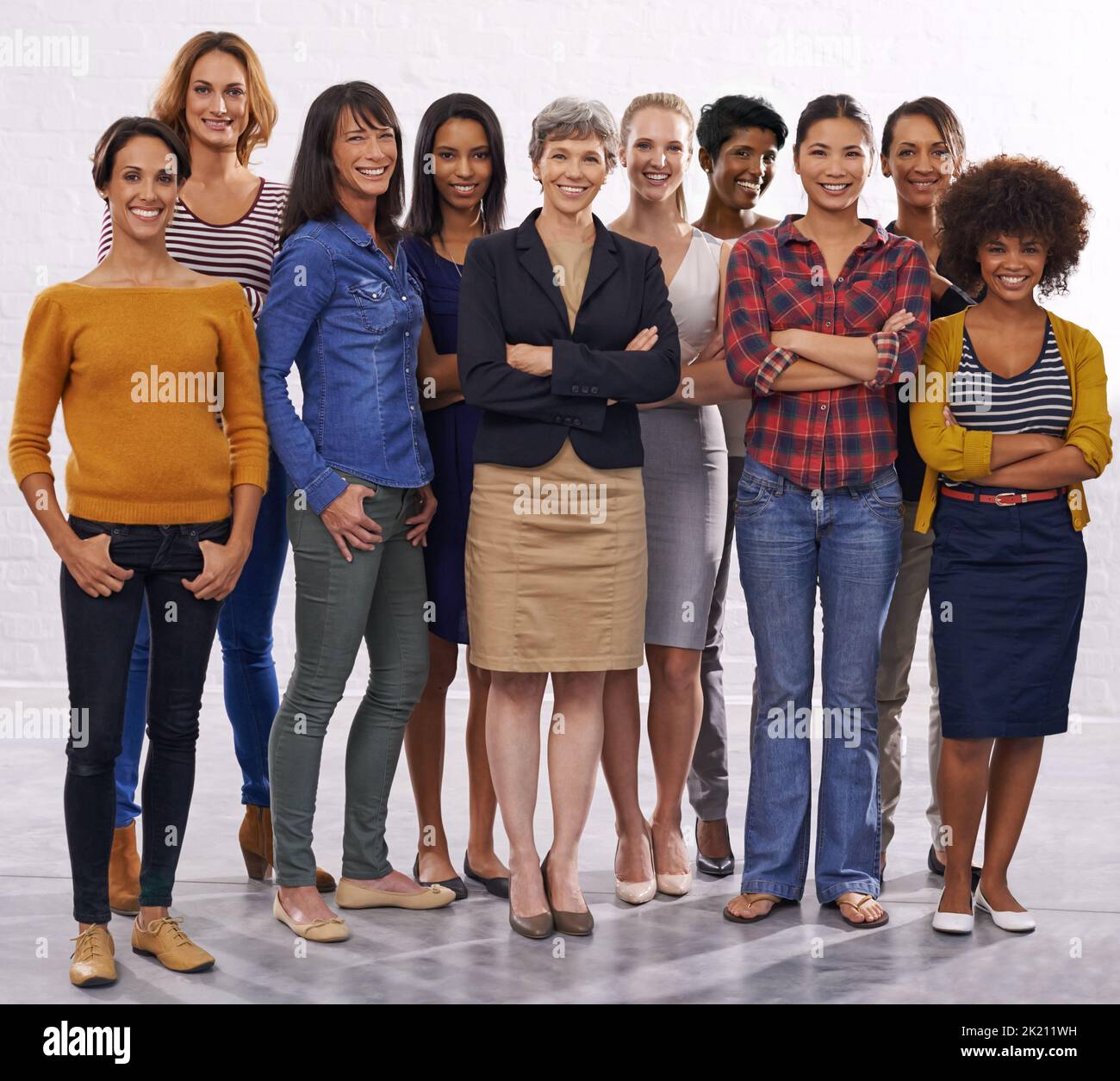 Women united. Full length studio of a group of happy people standing as ...