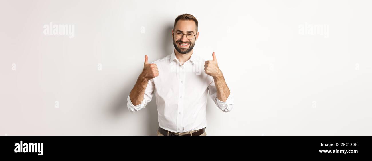 Successful businessman praising good work, showing thumbs up and ...