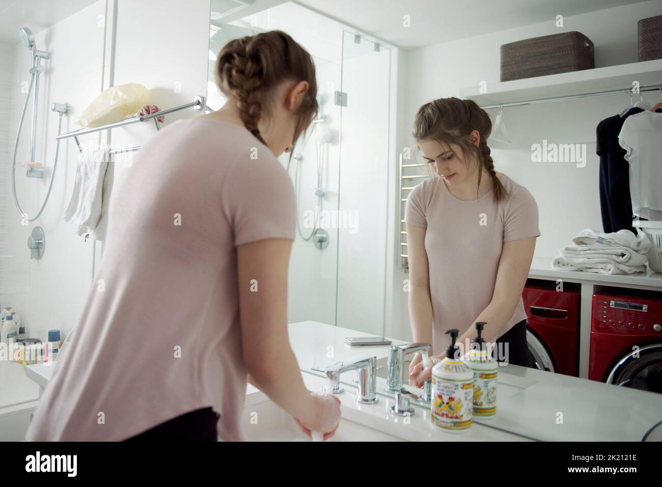 Teen washing hands hi-res stock photography and images - Alamy