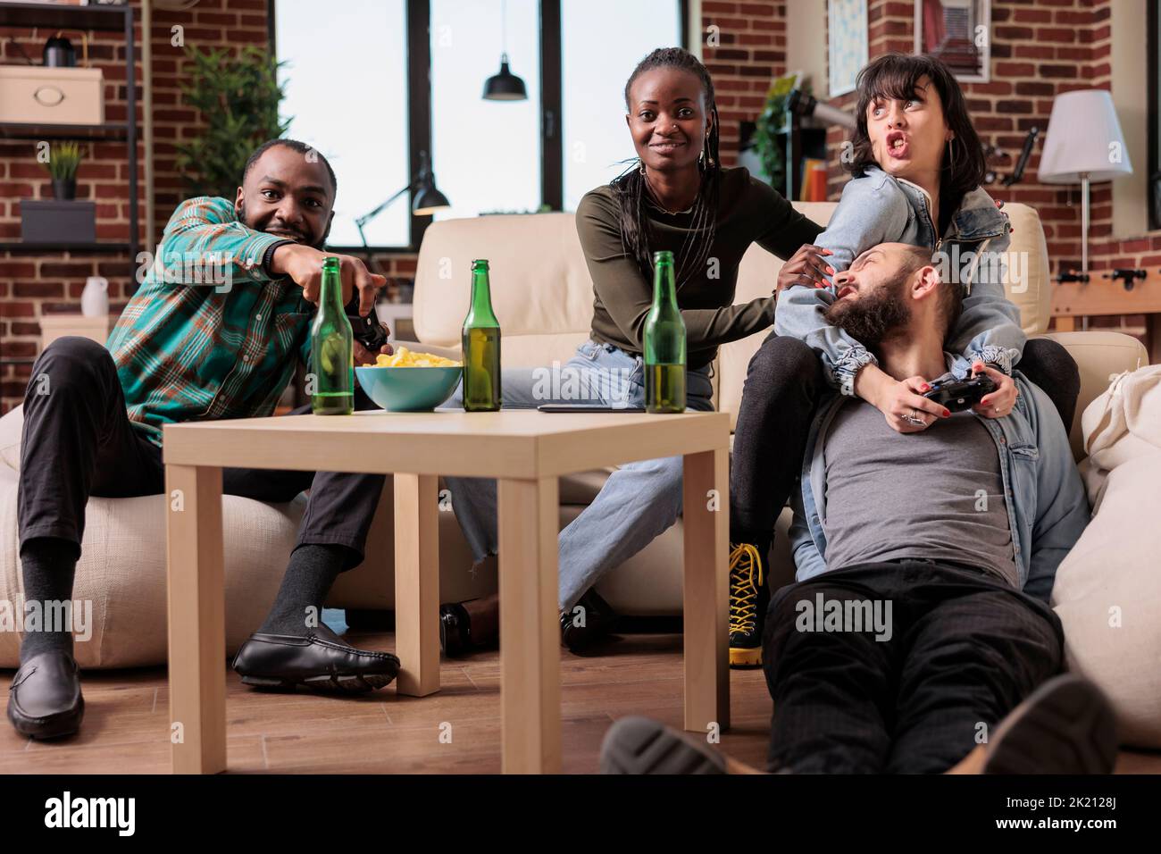 Multiethnic group of people feeling happy and playing video games on ...