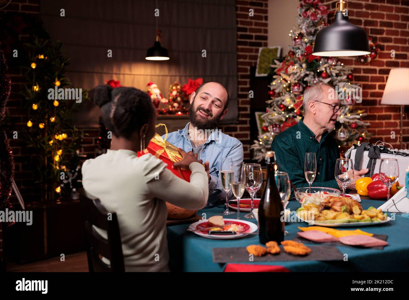 Diverse couple exchanging gift box hi-res stock photography and images ...