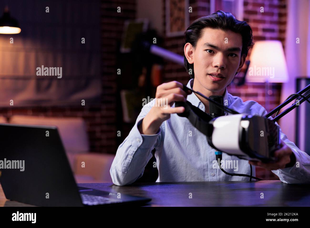 Lifestyle influencer recording video recommendation with vr glasses on ...