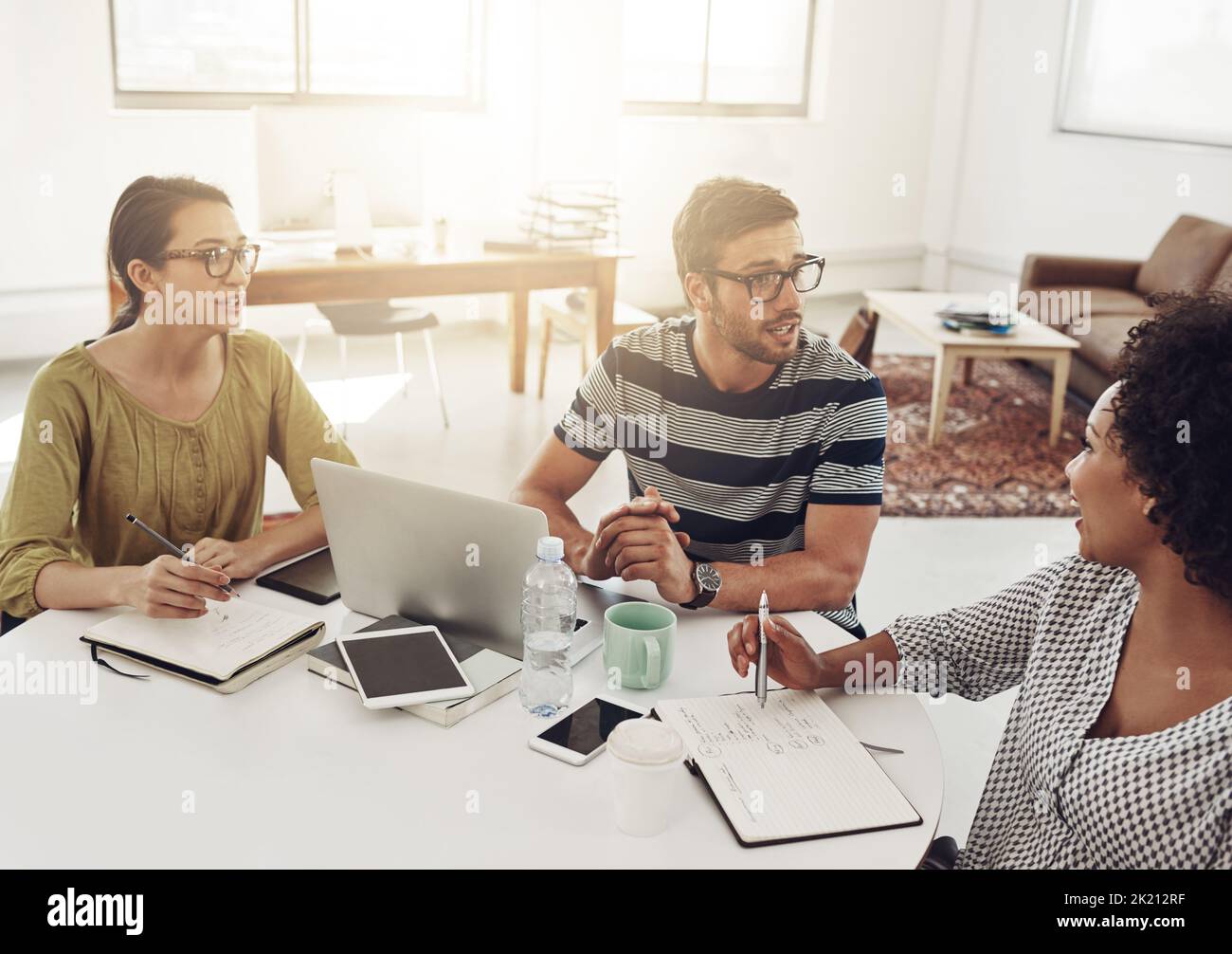 This team works hard for success. a group of coworkers having a meeting ...