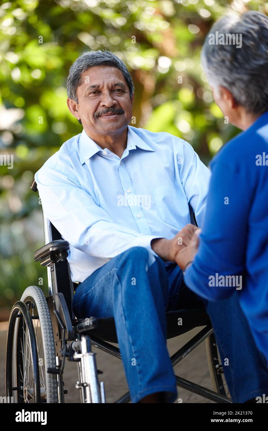 Supportive, through everything. a senior couple talking outdoors Stock ...