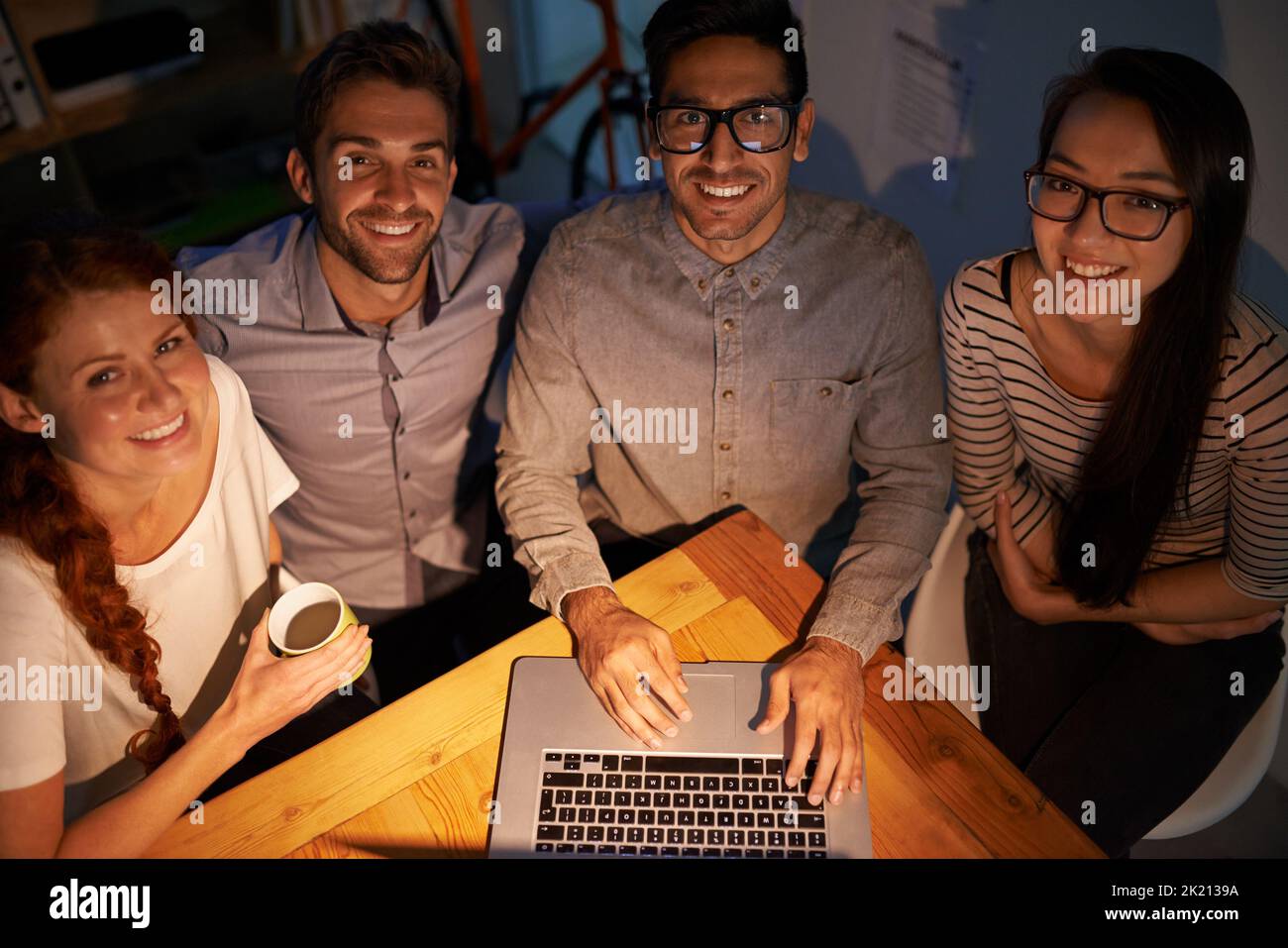 We dont mind working late. coworkers working into the evening in the ...