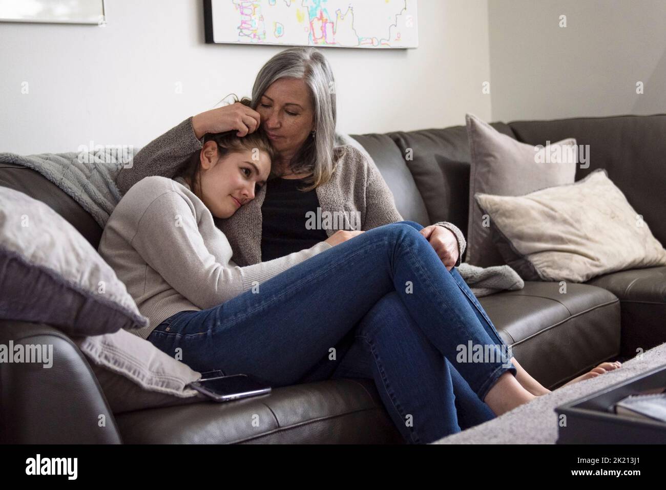 Teenage daughter comforting her mother hi-res stock photography and images - Alamy