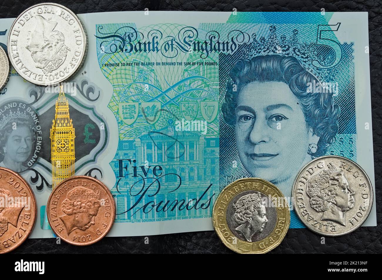 British £5 note and various coins featuring Queen Elizabeth II Stock ...
