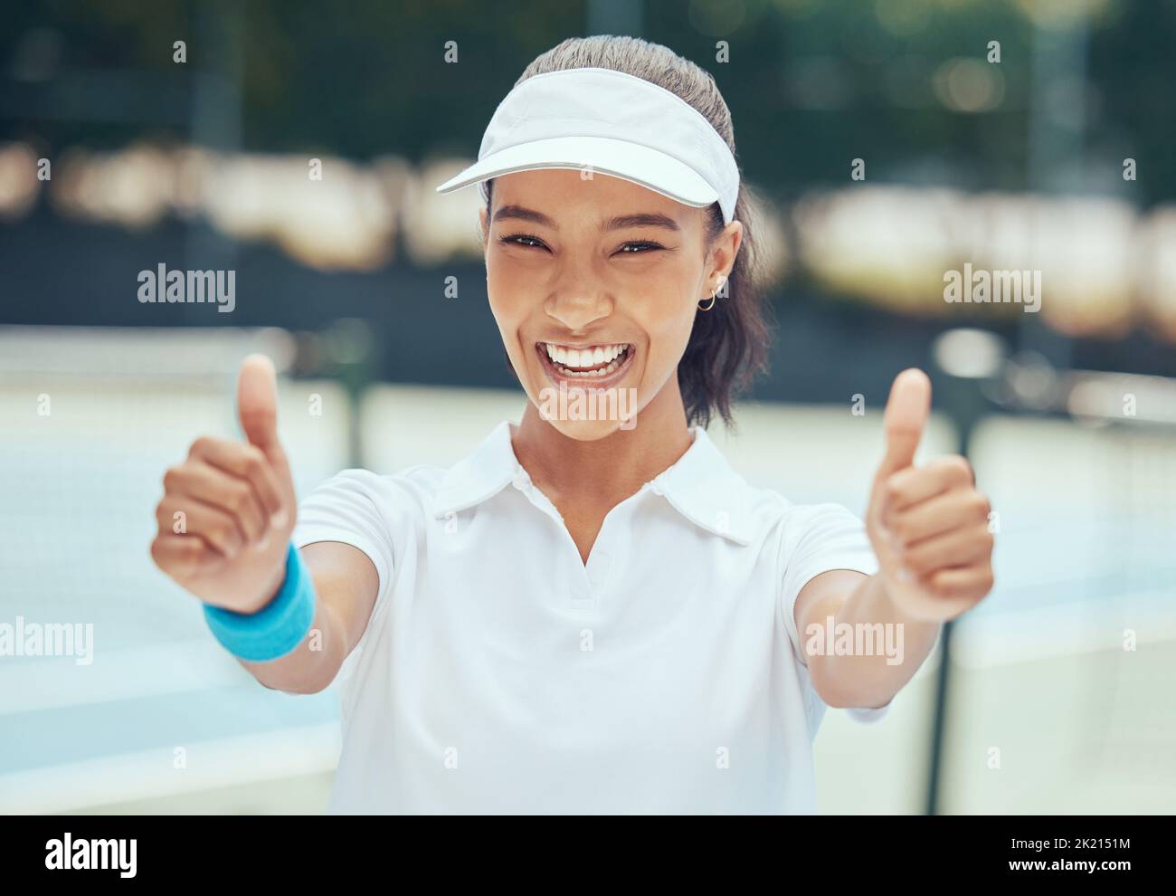 Success, motivation and thumbs up by tennis player happy while training ...