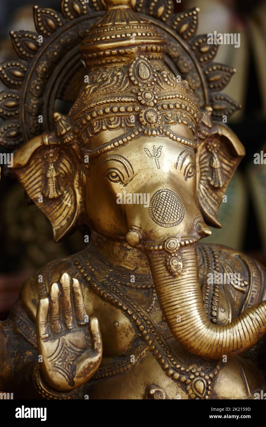 Ganesha in all his brilliance. Closeup of a bronze idol of the Hindu ...