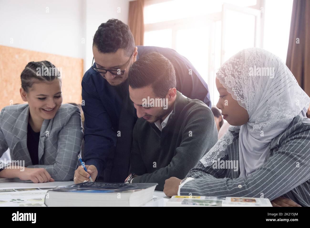 Professor having discussion with his college students Stock Photo - Alamy