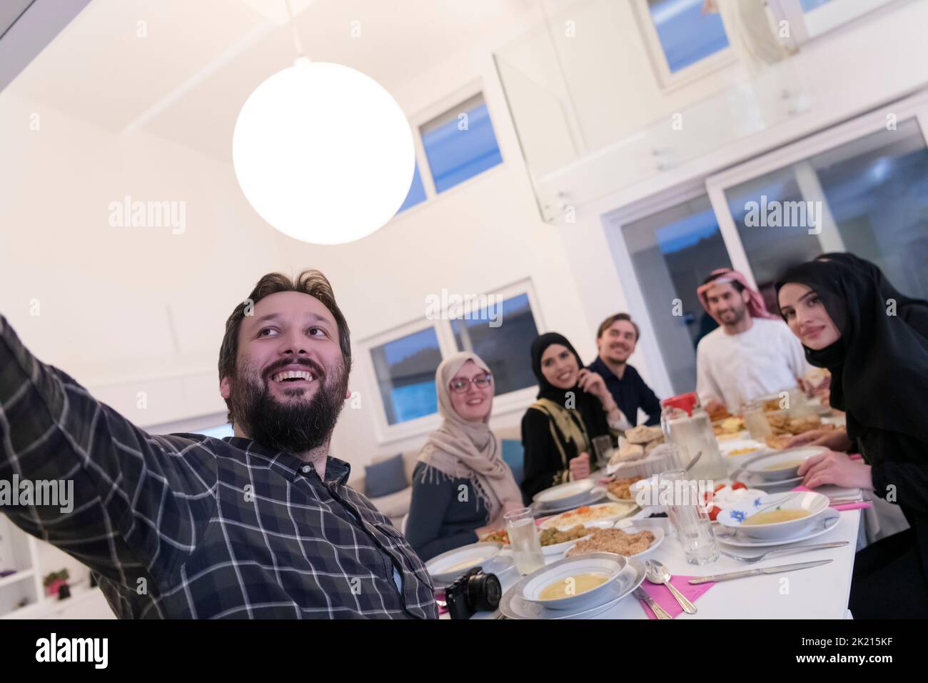 Eid Mubarak Muslim family having Iftar dinner taking pictures with ...