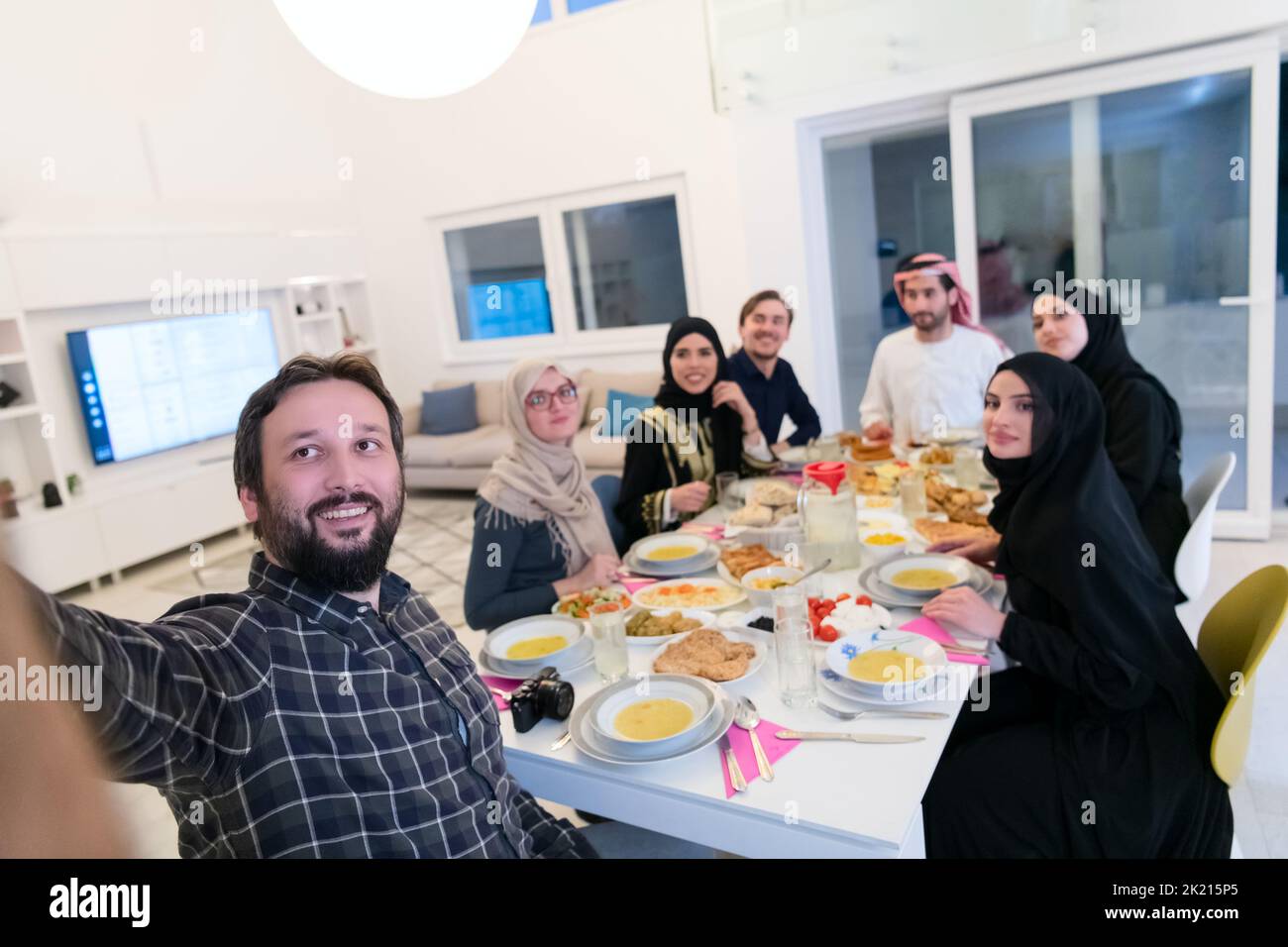 Eid Mubarak Muslim family having Iftar dinner taking pictures with ...