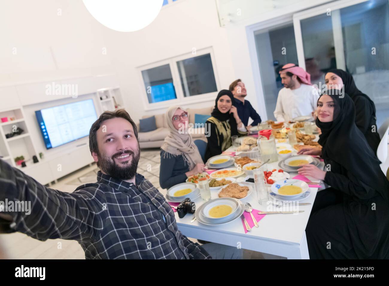Eid Mubarak Muslim family having Iftar dinner taking pictures with ...