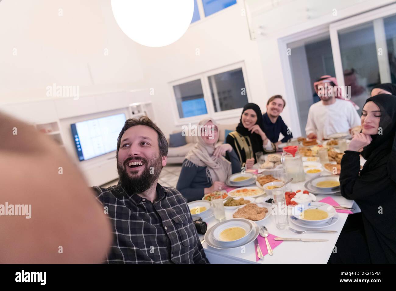 Eid Mubarak Muslim family having Iftar dinner taking pictures with ...