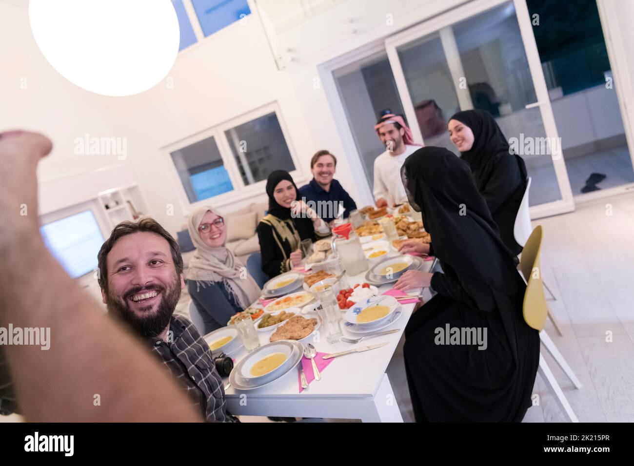 Eid Mubarak Muslim family having Iftar dinner taking pictures with ...