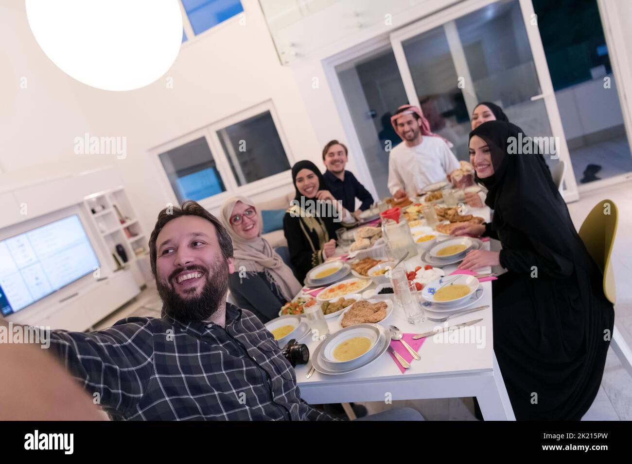 Eid Mubarak Muslim family having Iftar dinner taking pictures with ...