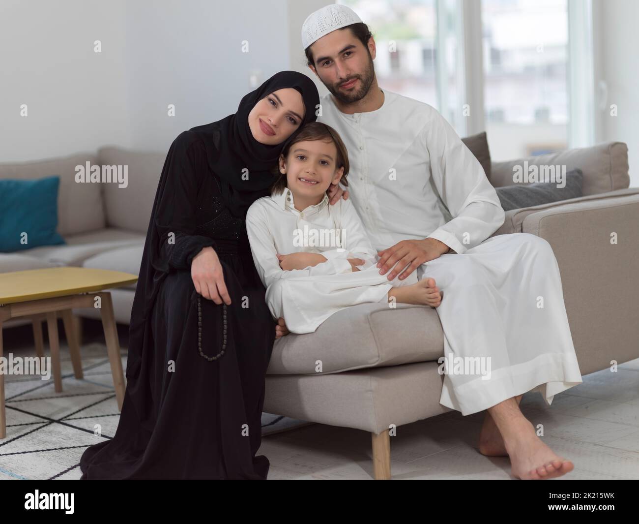 Traditional muslim family parents with children reading Quran and ...