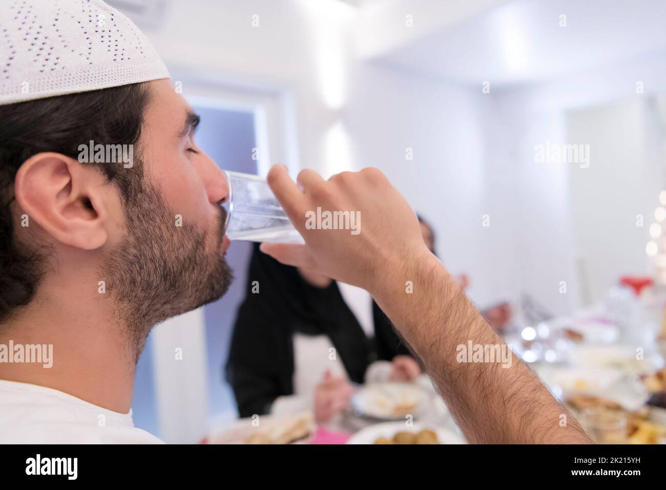 Muslim family making iftar dua to break fasting during Ramadan Stock ...