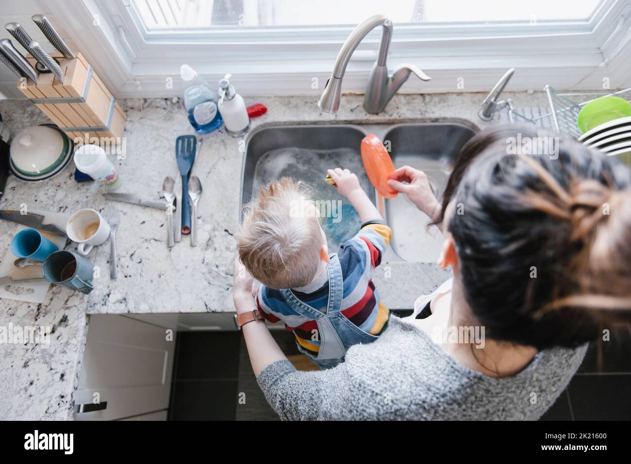 Toddler boy child washing up kitchen hi-res stock photography and ...