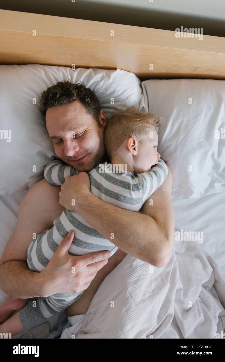 Cuddle in bed hi-res stock photography and images - Alamy