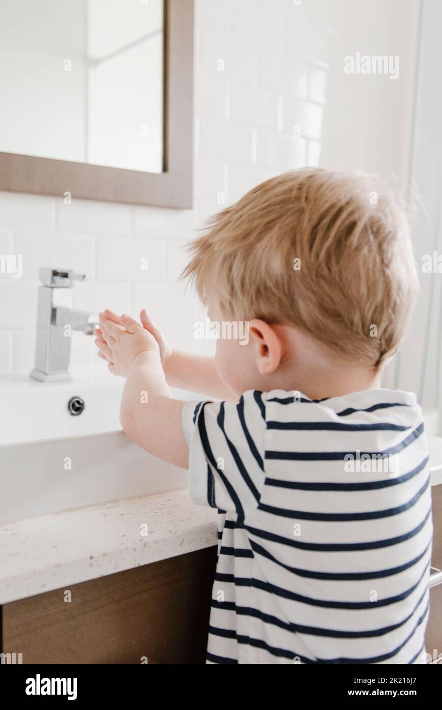 Hands washing basin hi-res stock photography and images - Alamy