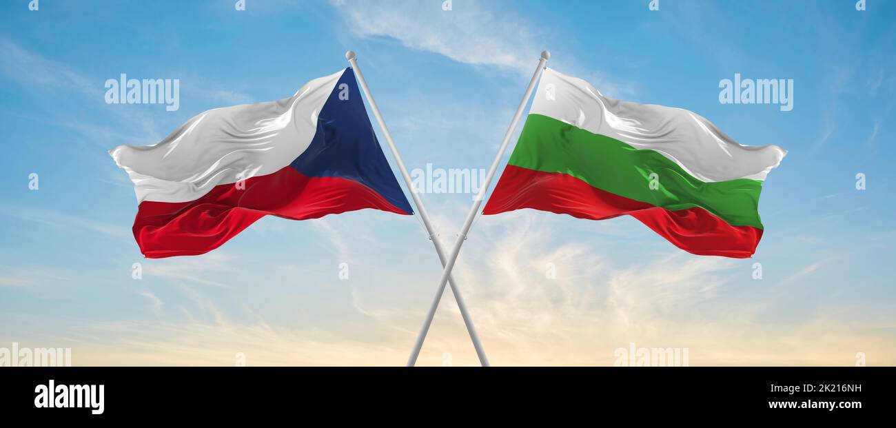 two crossed flags Bulgaria and Czech republic waving in wind at cloudy ...