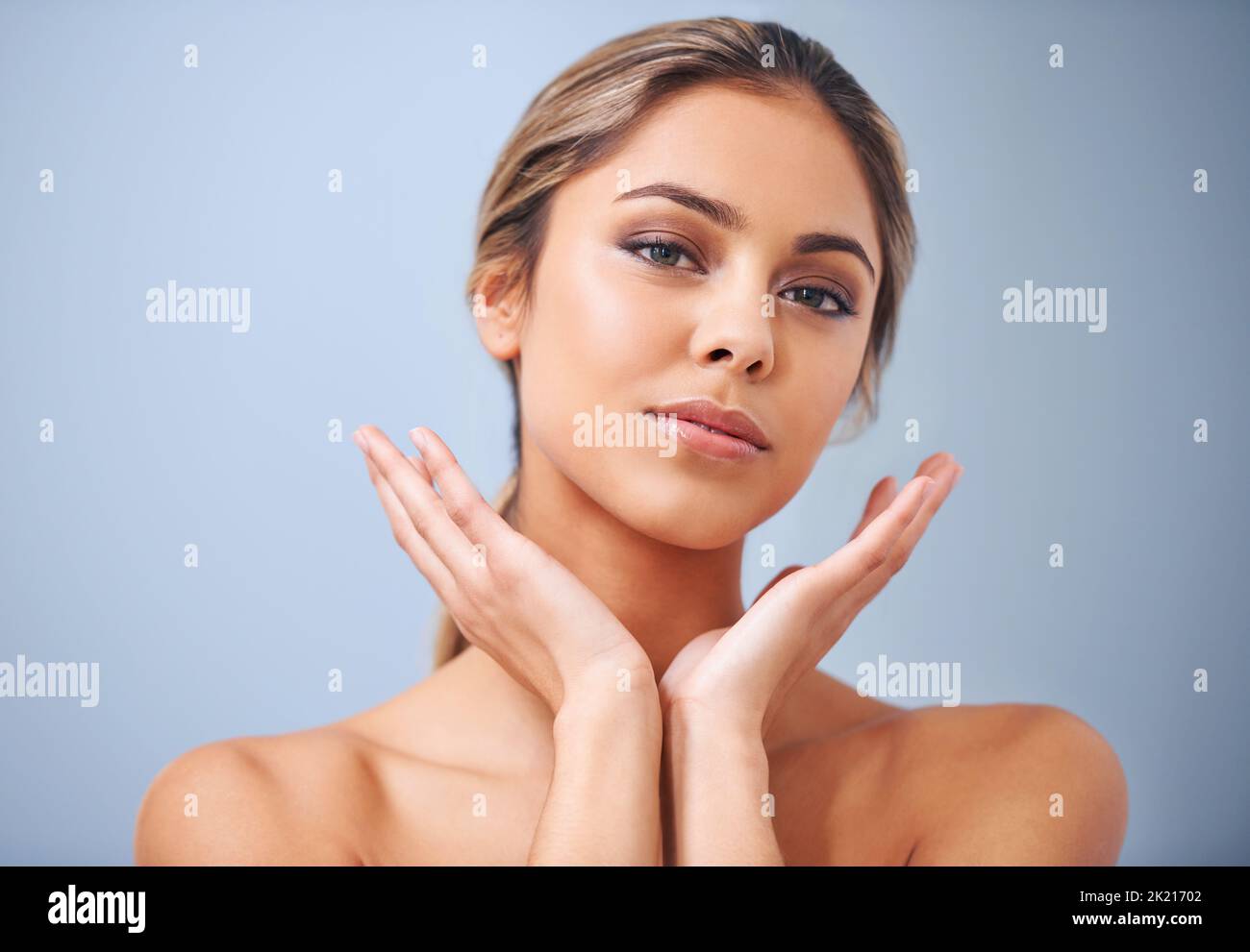 Have you ever seen skin this smooth. Studio shot of a beautiful young ...