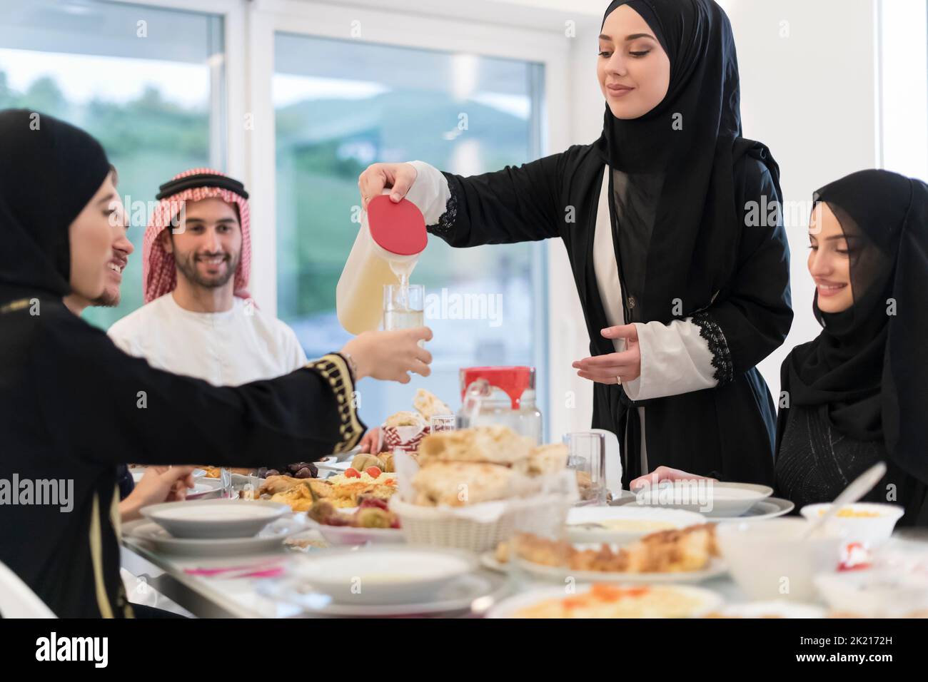 Eid Mubarak Muslim family having Iftar dinner drinking water to break ...