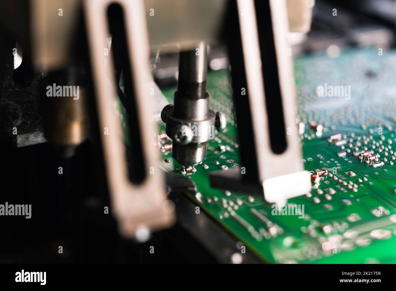 Indoor closeup shot showing the process of creating modern PCB that is ...