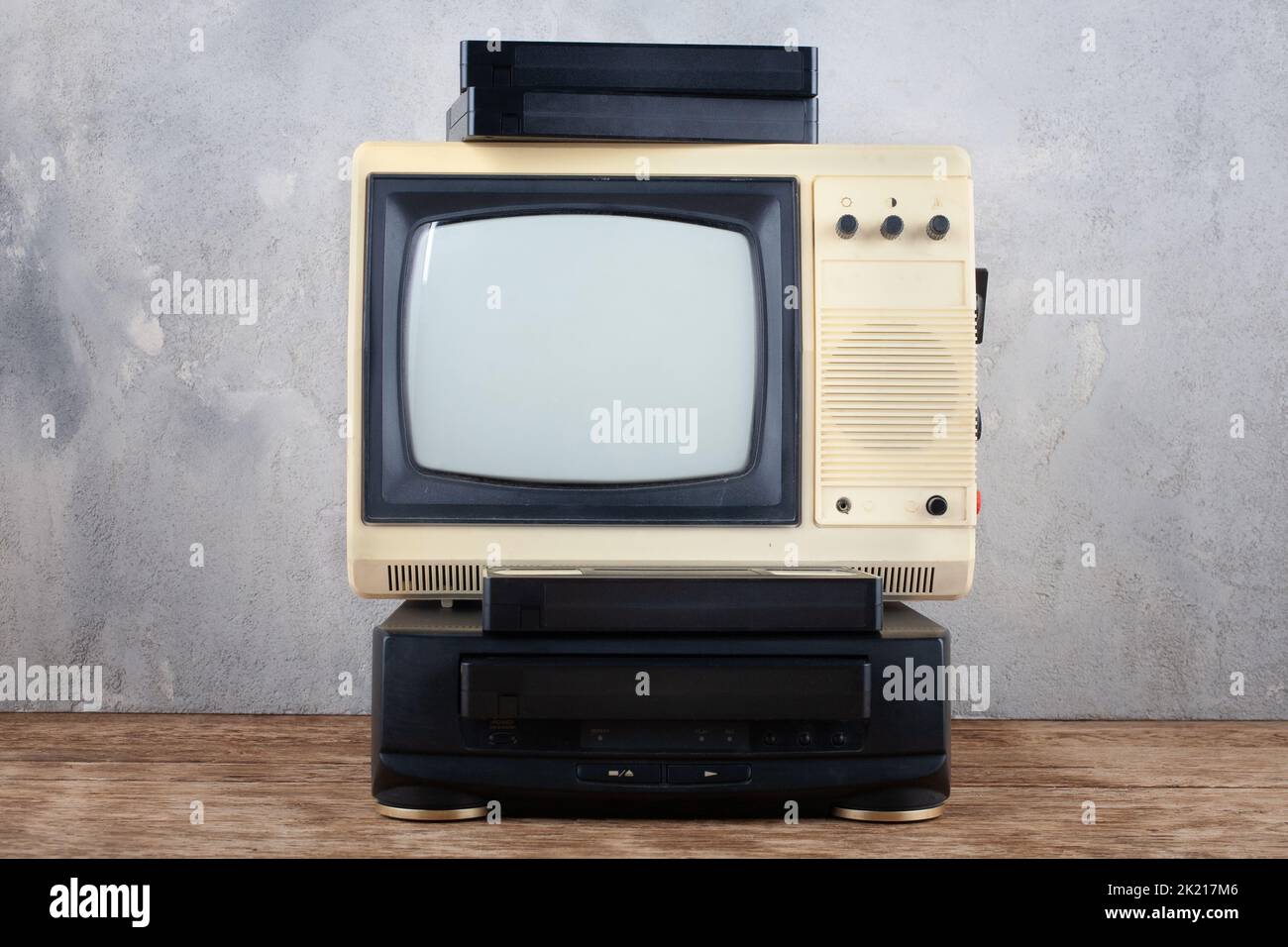 Vintage retro analog small TV set with VHS video player and ...