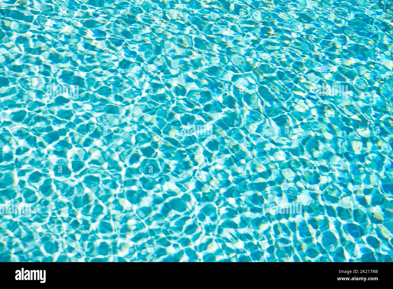 blue color backdrop of swimming pool water with ripples. concept of ...