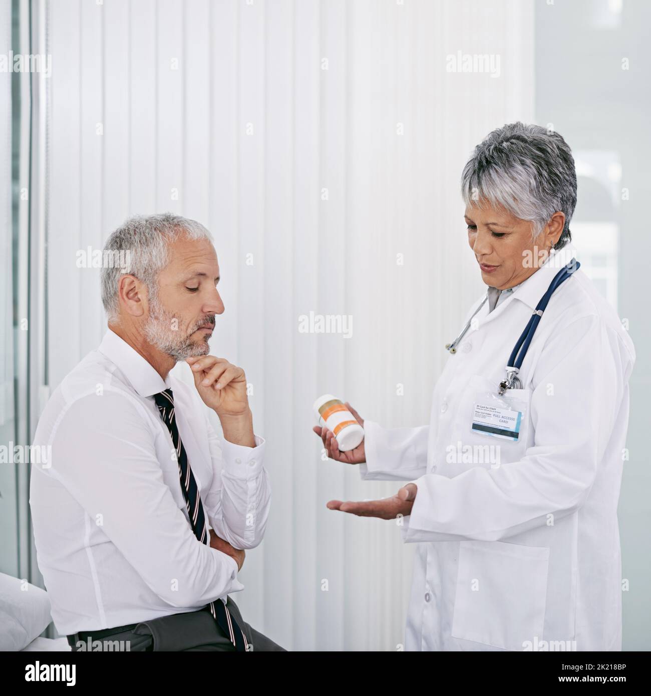Take these tablets twice daily before meals. a doctor giving a bottle ...