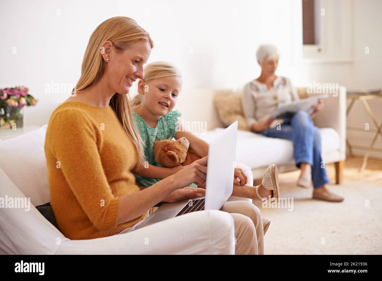 Soaking up everything she sees. a young woman and her daughter sitting ...