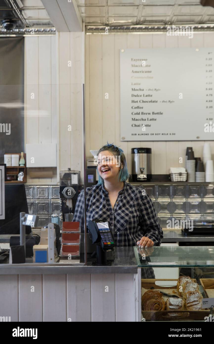 Barista behind cafe counter hi-res stock photography and images - Alamy