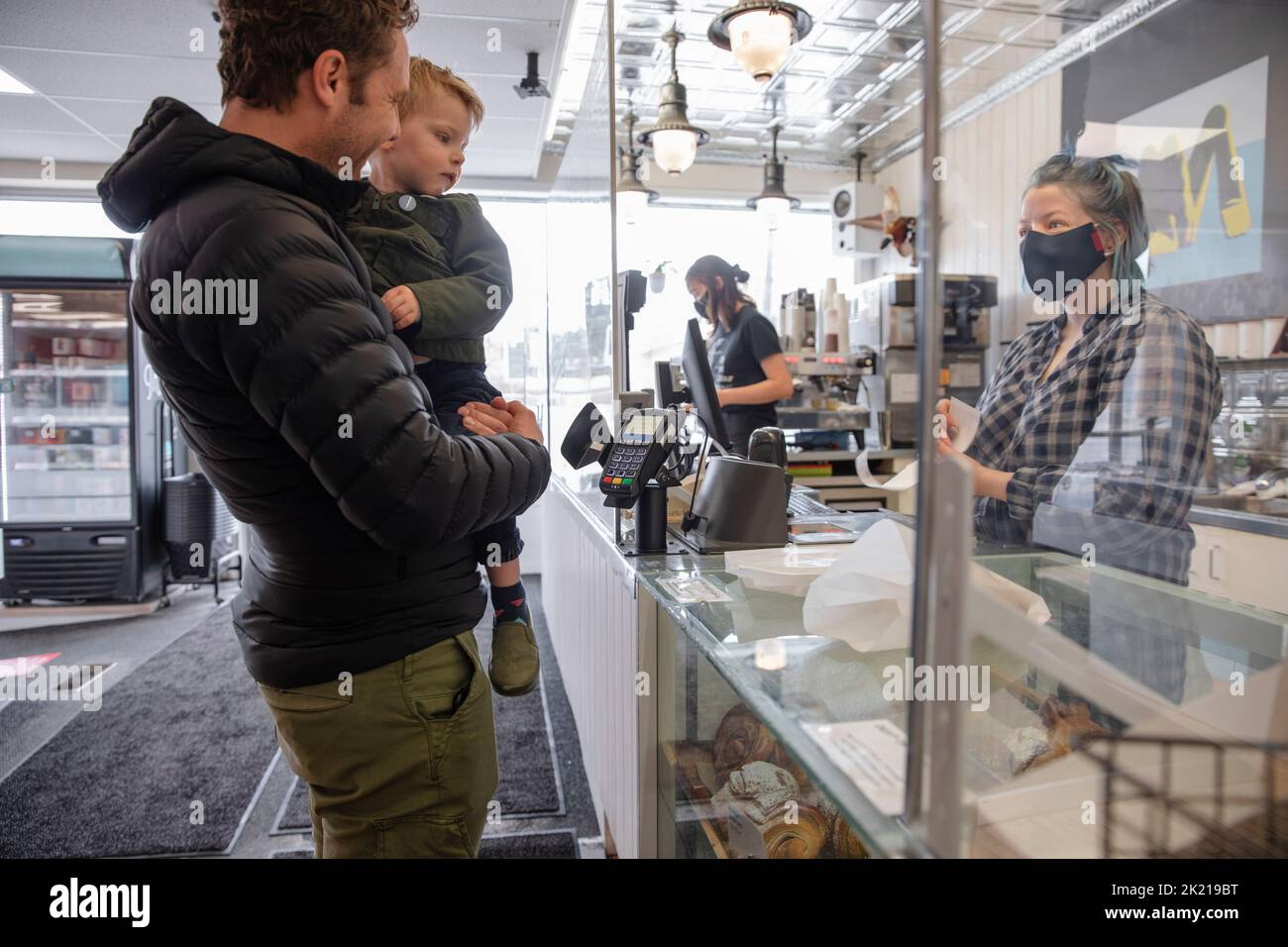 Boy working as a cashier hi-res stock photography and images - Alamy
