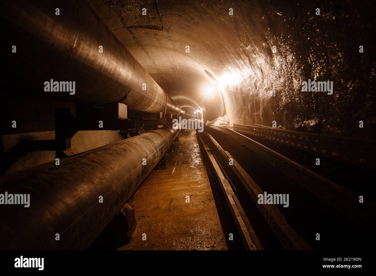 Round concrete underground tunnel of sewer, heating duct or water ...