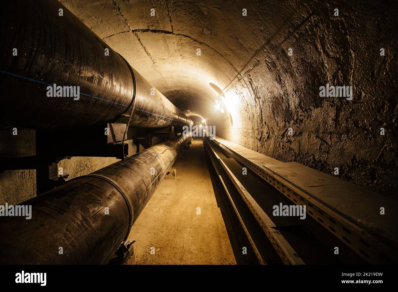 Vaulted concrete underground tunnel of sewer, heating duct or water ...