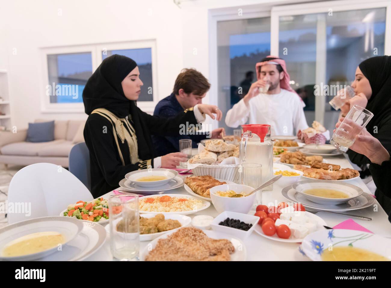 Muslim family making iftar dua to break fasting during Ramadan Stock ...