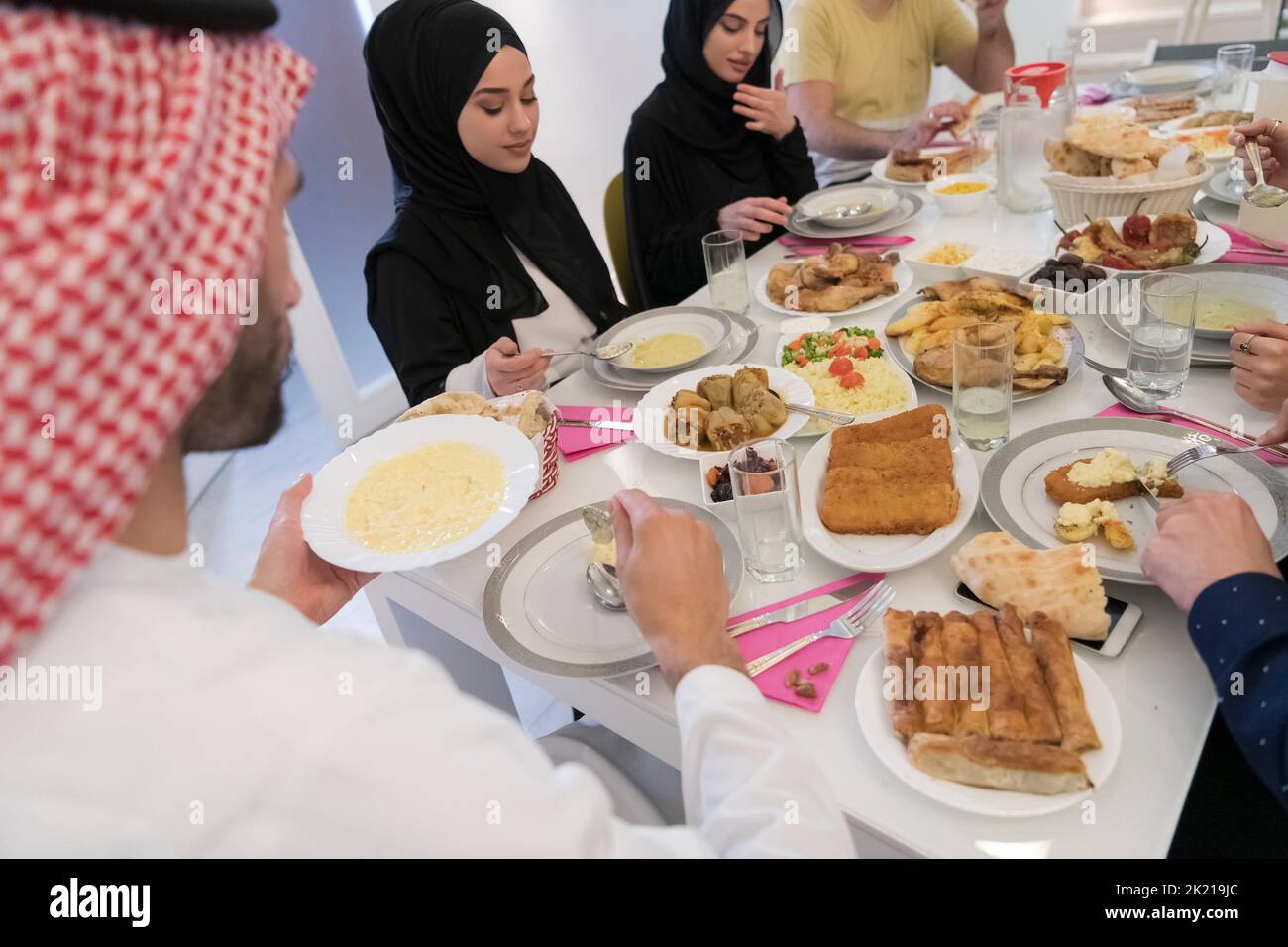 Eid Mubarak Muslim family having Iftar dinner drinking water to break ...