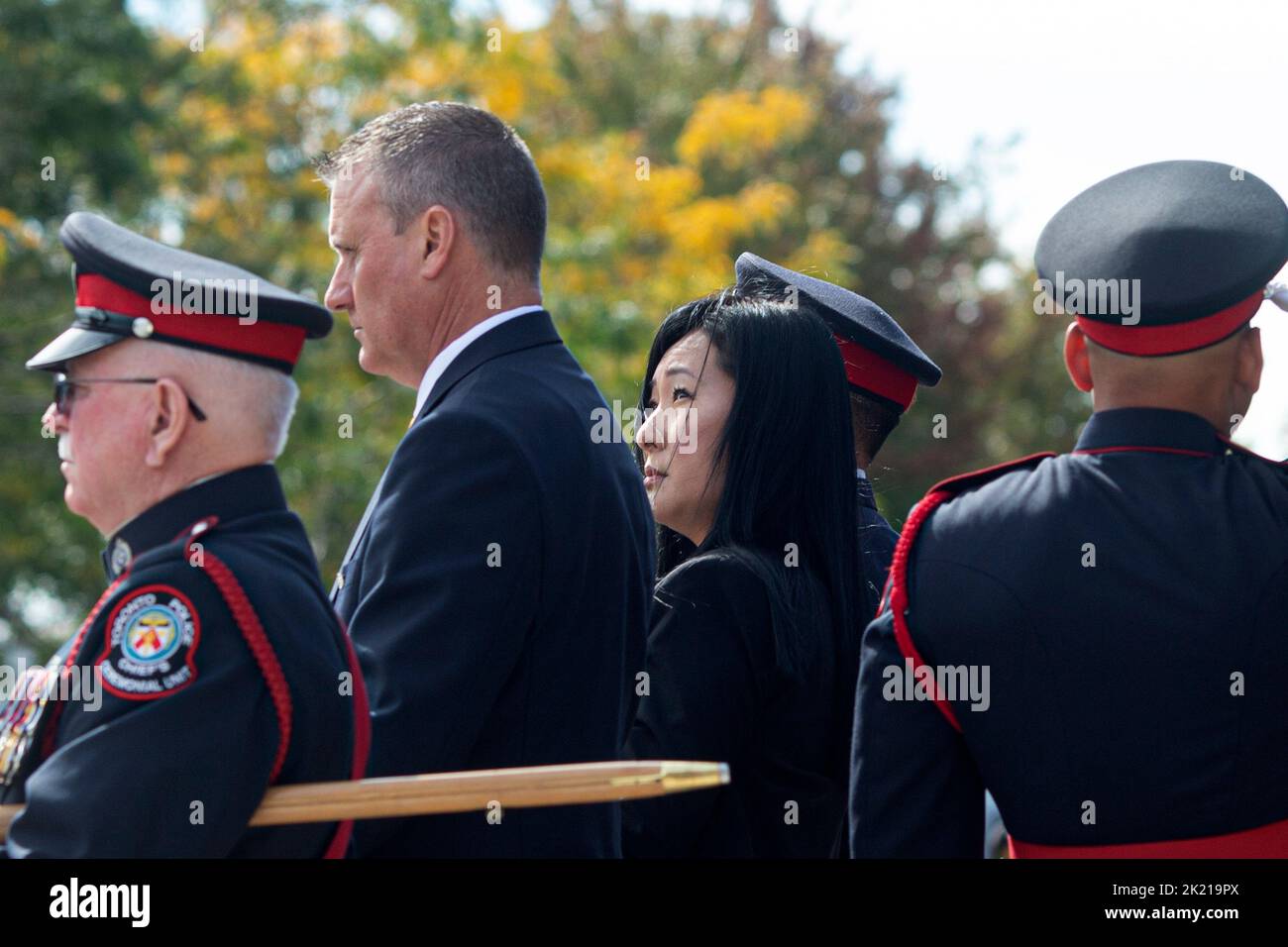 Jenny Hong, centre right, the wife of Toronto Police Const. Andrew Hong ...