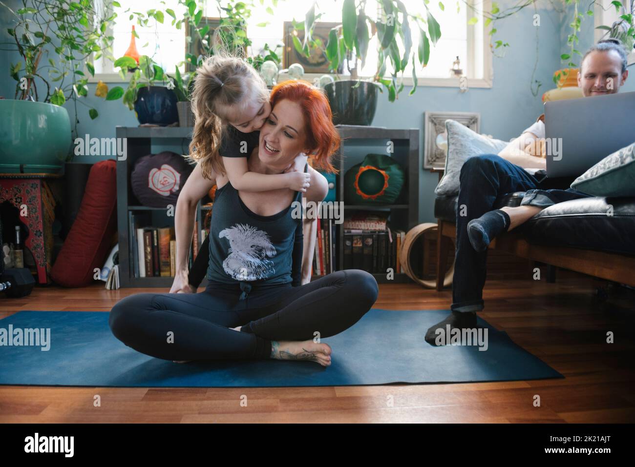 Woman sitting cross legged hugging hi-res stock photography and images ...