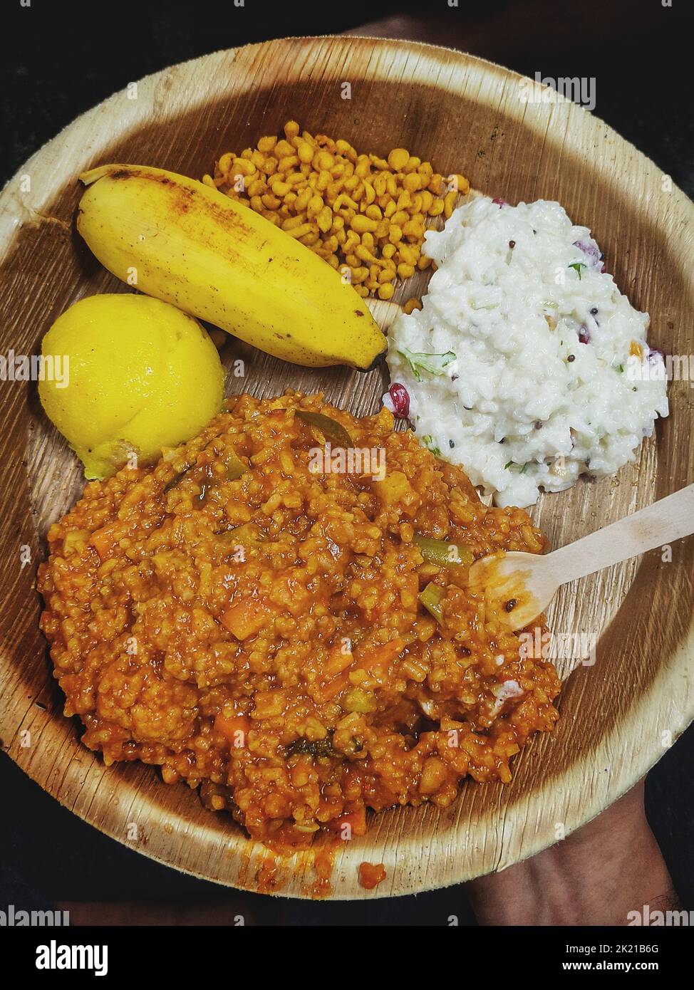 A vertical shot of the South Indian platter consisting of Bisi Bele ...