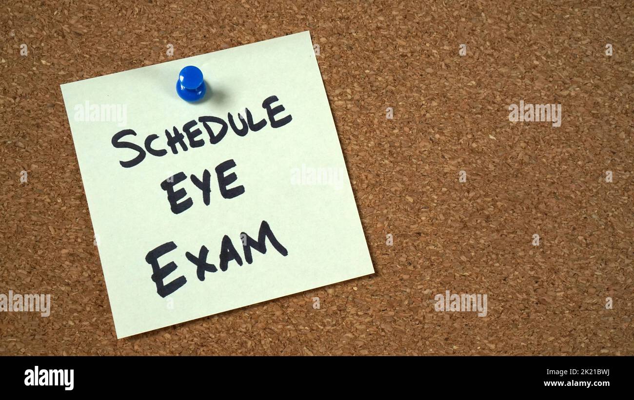 Sticky note reminder to schedule eye exam Stock Photo - Alamy