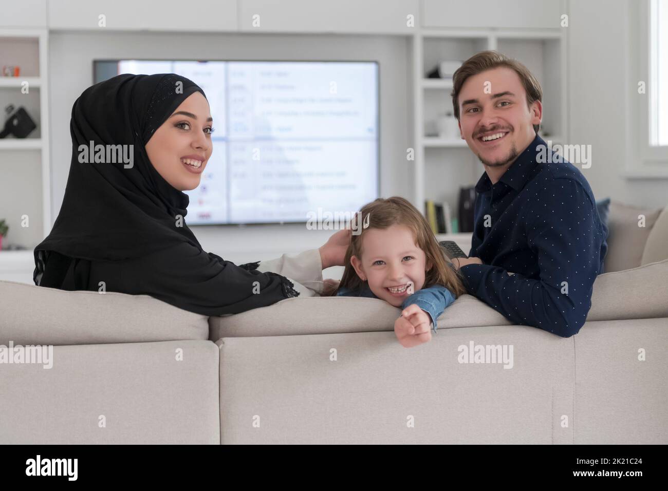 Happy Muslim family with daughter woman in traditional fashionable ...