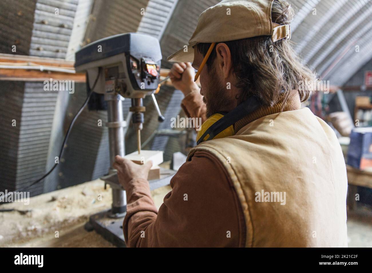 Male carpenter using drill press hi-res stock photography and images ...