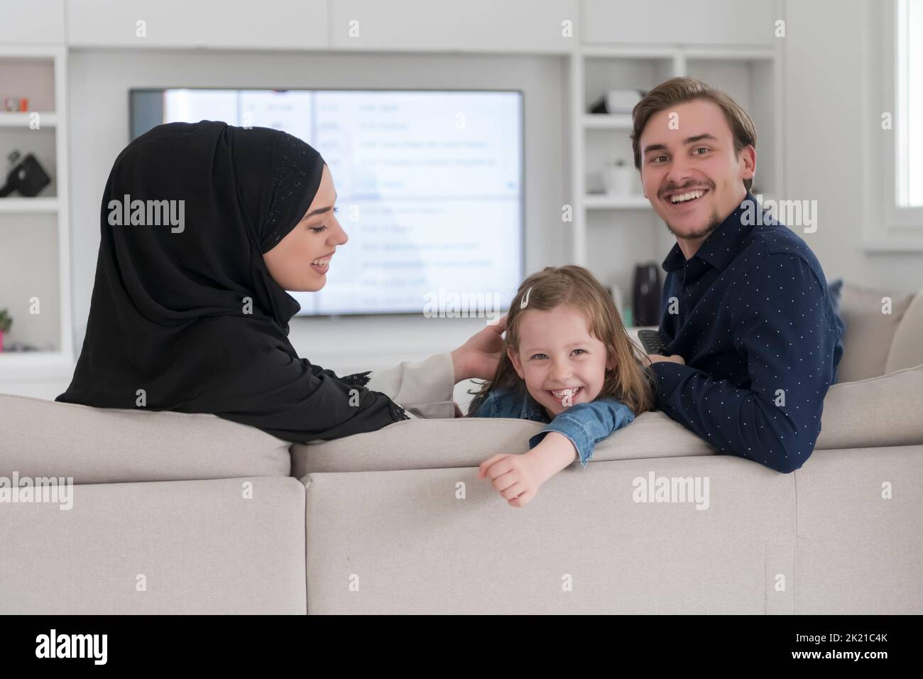 Happy Muslim family with daughter woman in traditional fashionable ...