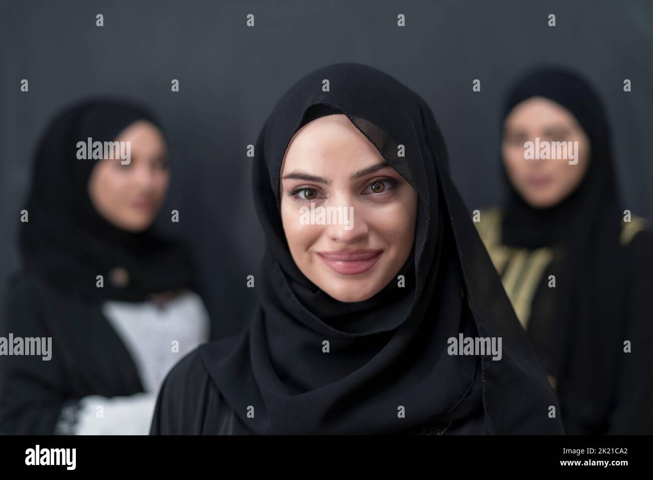 Group portrait of beautiful Muslim women in a fashionable dress with ...