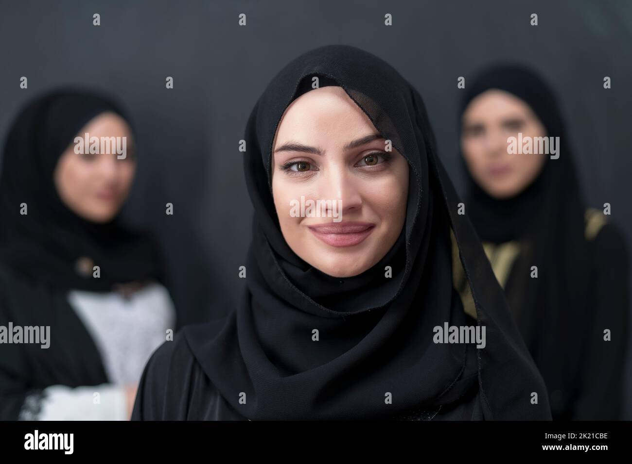 Group portrait of beautiful Muslim women in a fashionable dress with ...