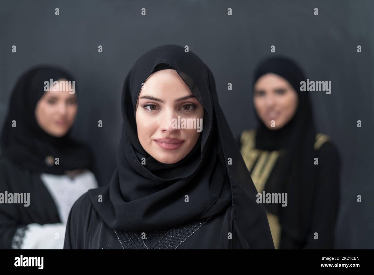 Group portrait of beautiful Muslim women in a fashionable dress with ...
