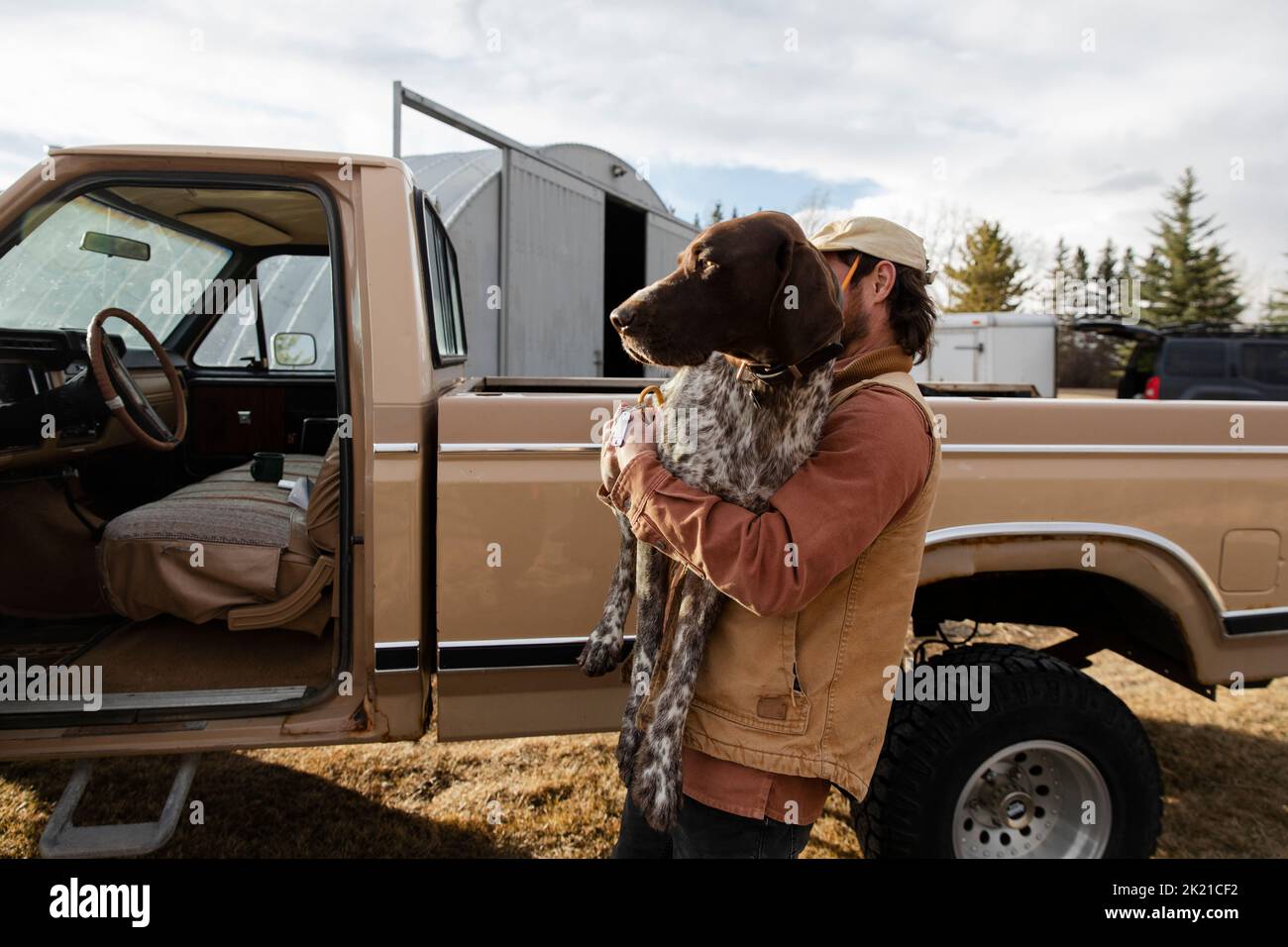 Person carrying dog hi-res stock photography and images - Alamy